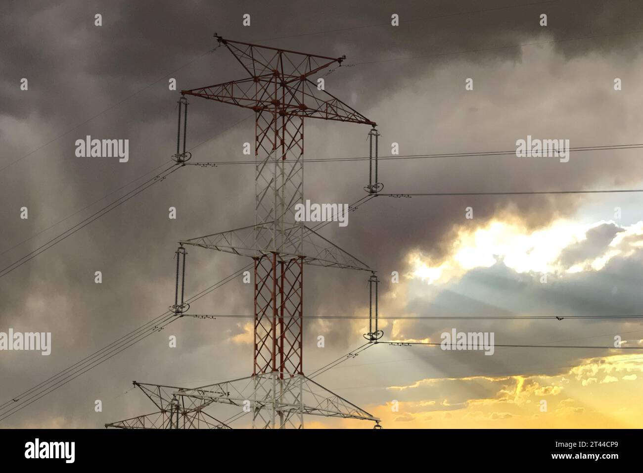 Power lines and tower, stormy sky Stock Photo - Alamy