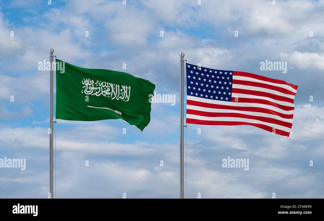 USA and Saudi Arabia flags waving together in the wind on blue cloudy ...