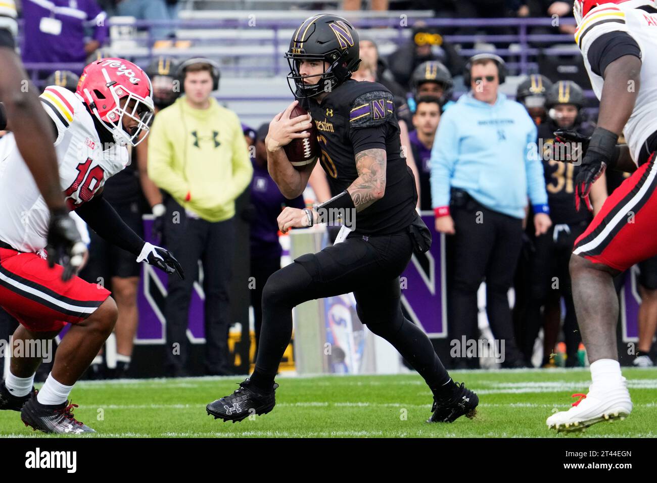 Northwestern quarterback Brendan Sullivan runs with a ball against ...