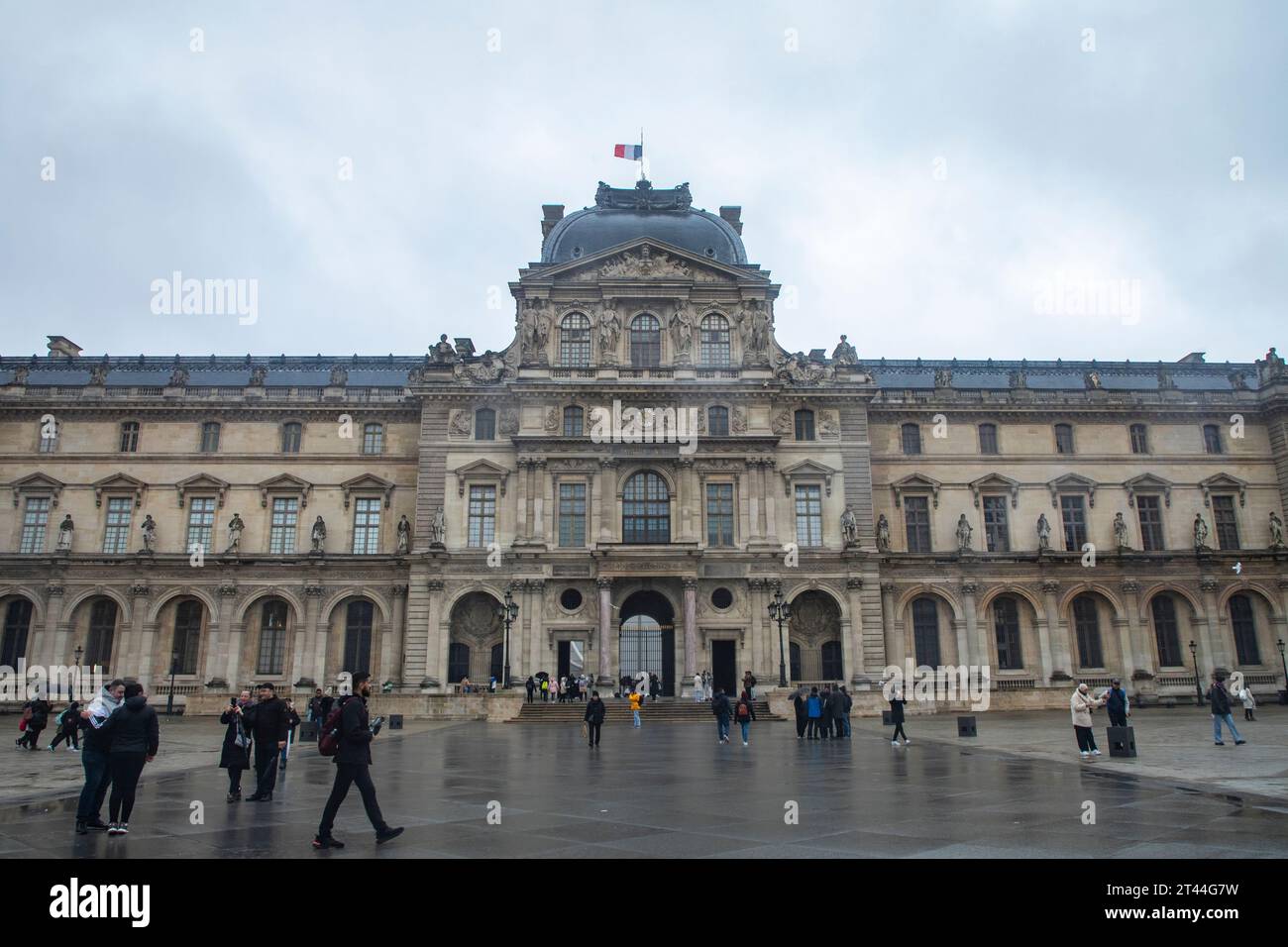 Visitors outside the Louvre art gallery and Museum entrance Paris ...