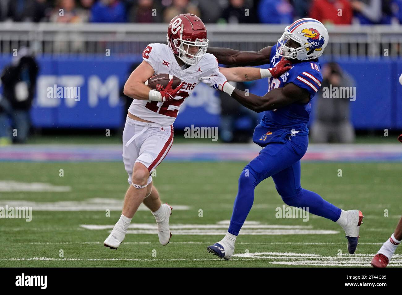 Oklahoma wide receiver Drake Stoops (12) is chased by Kansas linebacker ...
