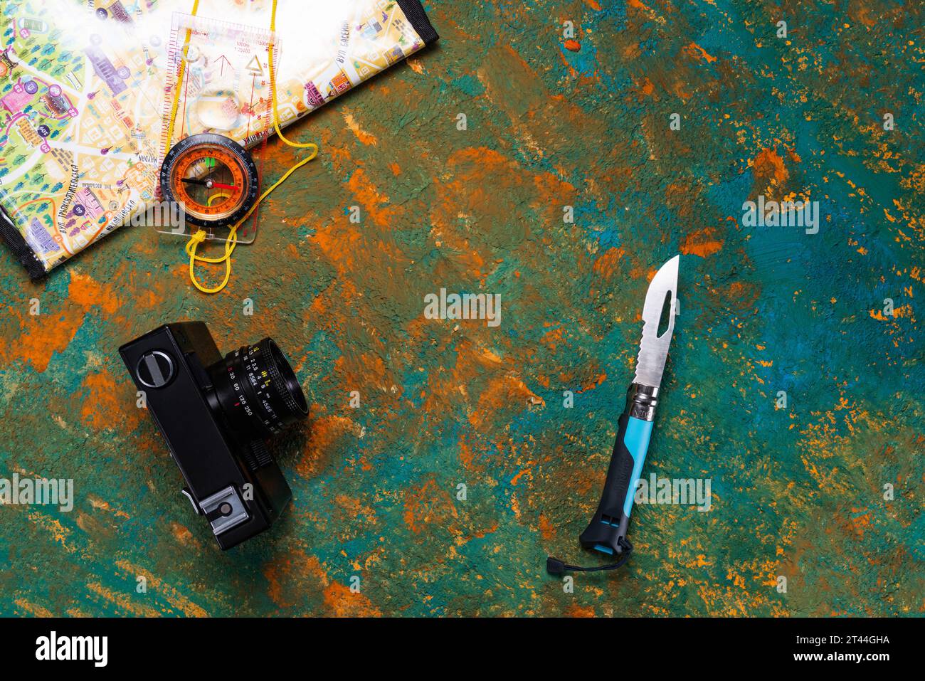 Tourist knife and camera. Camera and map. Tourism. View from above ...