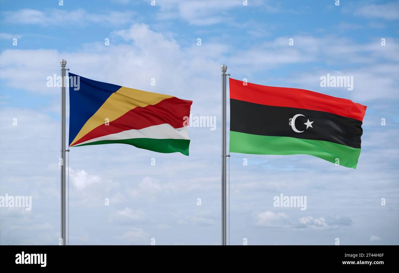 Libya and Seychelles flags waving together in the wind on blue cloudy sky, two country ...