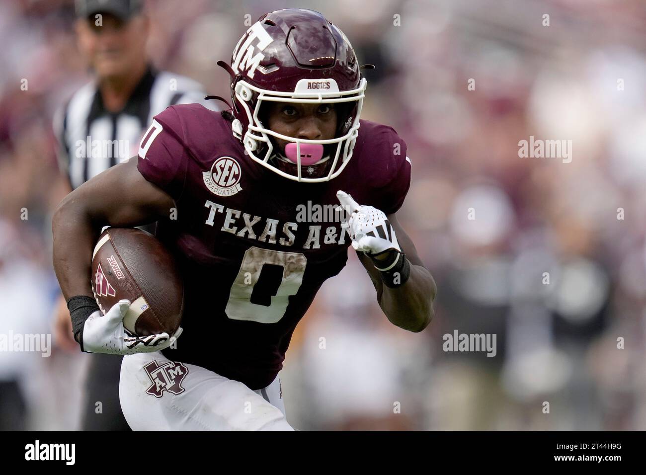 Texas A&M wide receiver Ainias Smith (0) runs for yardage after a catch ...