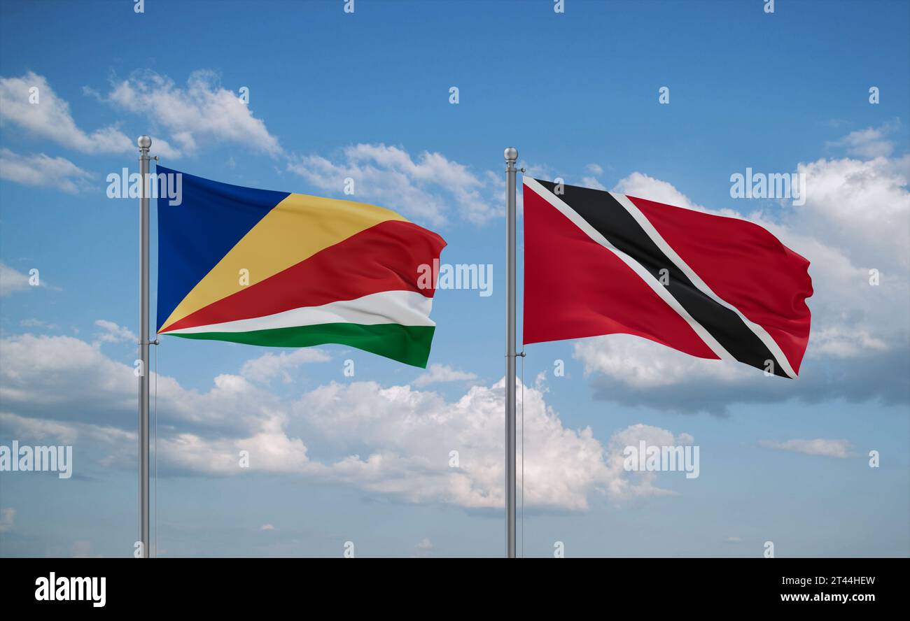 Trinidad and Tobago and Seychelles flags waving together in the wind on blue cloudy sky, two ...