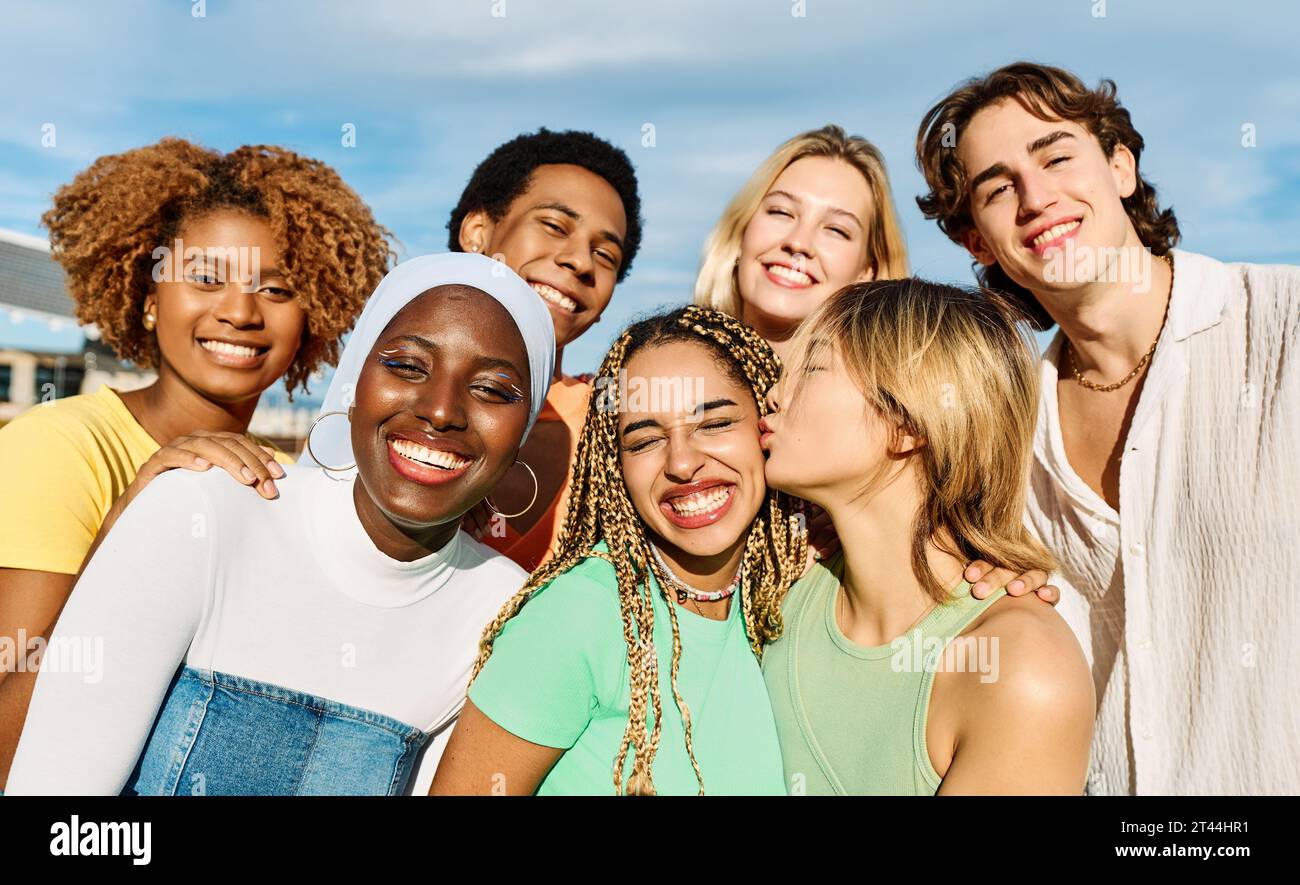 Young people of multiples cultures embracing and smiling Stock Photo ...