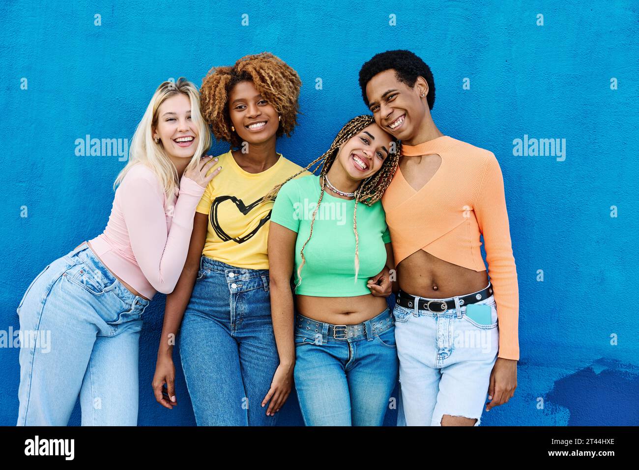 Cool young multi-ethnic and gender diverse friends posing outdoors ...