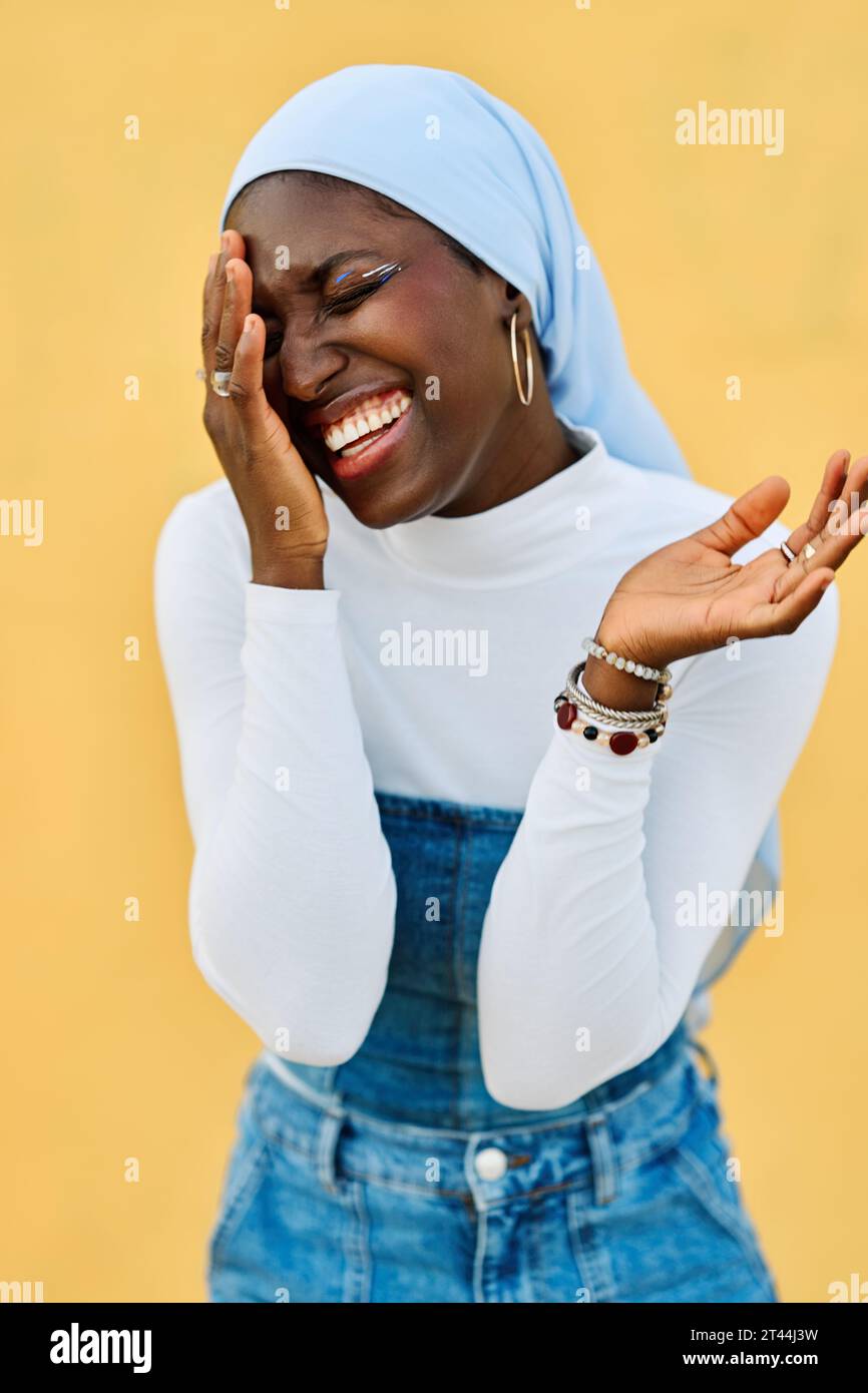 African muslim woman with hijab laughing happily Stock Photo - Alamy
