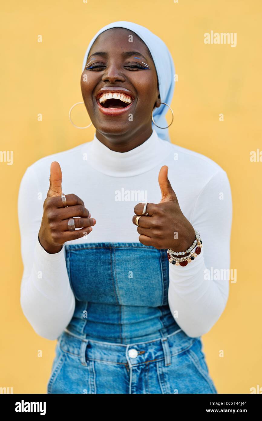 Happy african muslim woman gesturing agreement raising a thumb up Stock ...