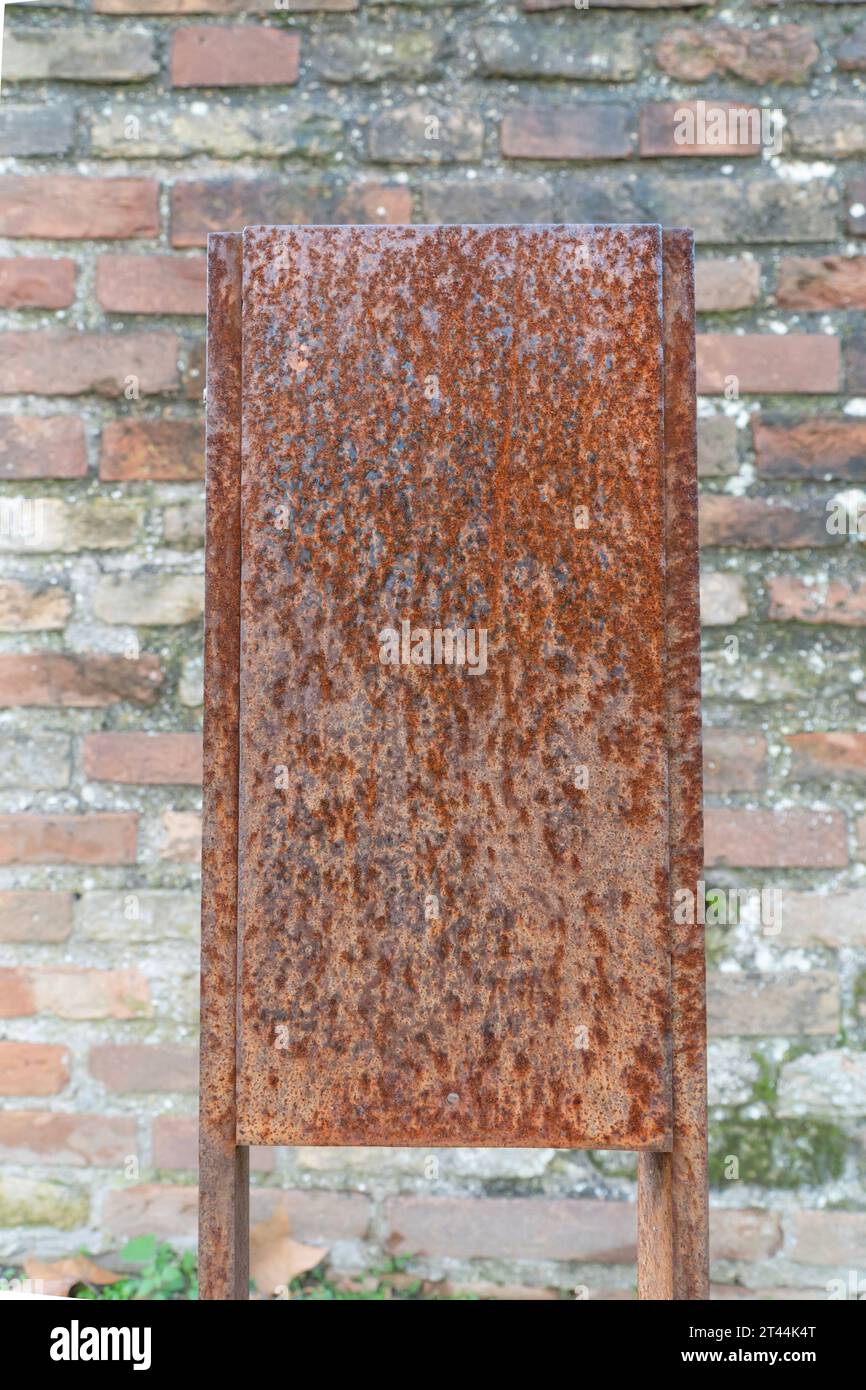 background, brown rust textured board with copy space over brick wall ...