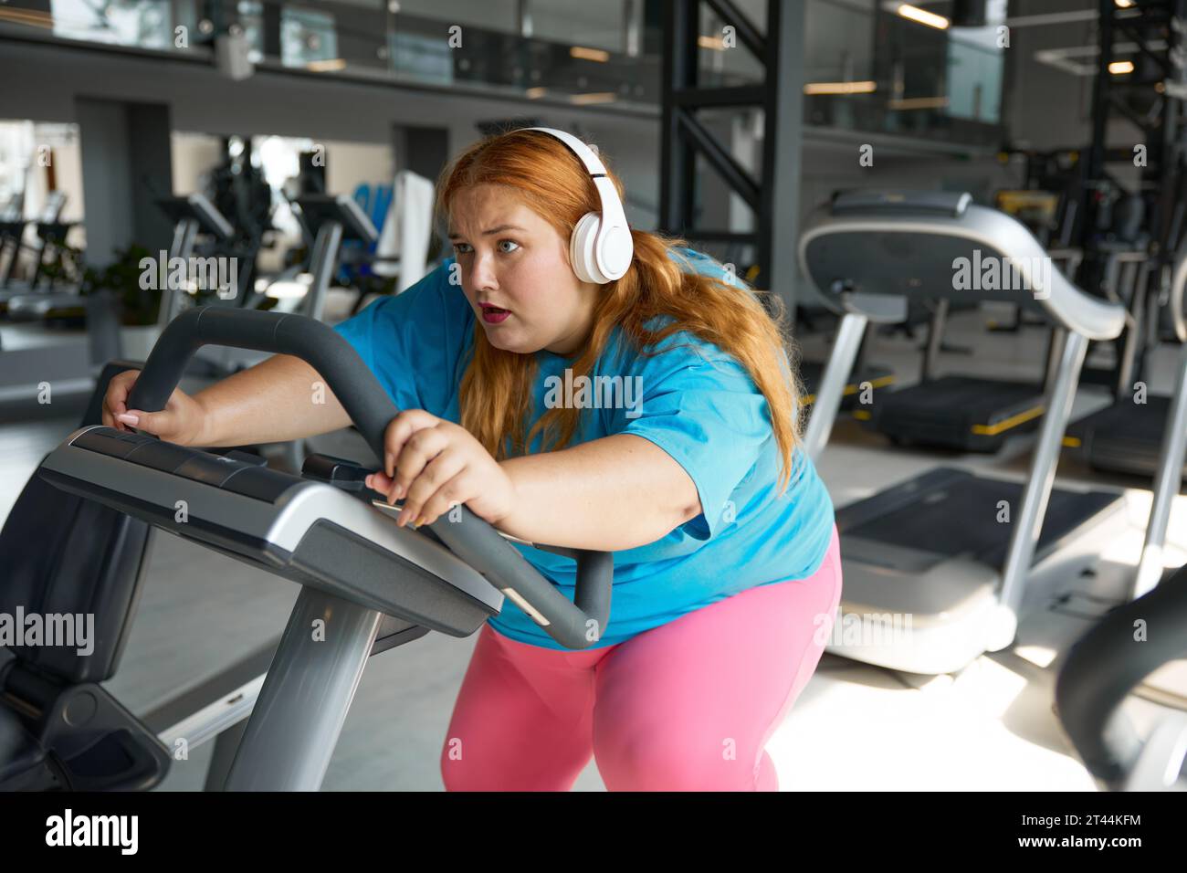 Overweight woman riding bike hi-res stock photography and images - Alamy