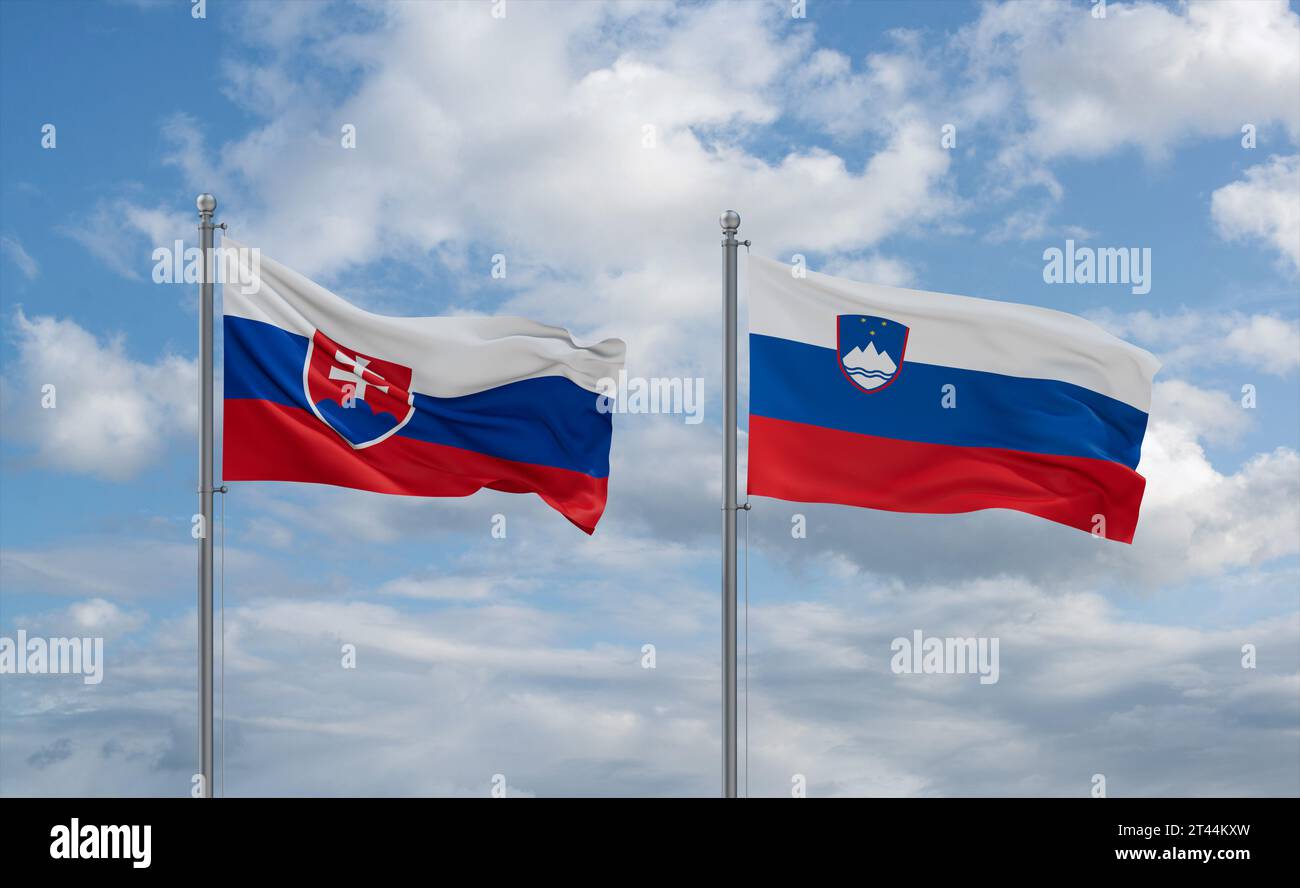 Slovenia and Slovakia flags waving together in the wind on blue cloudy ...