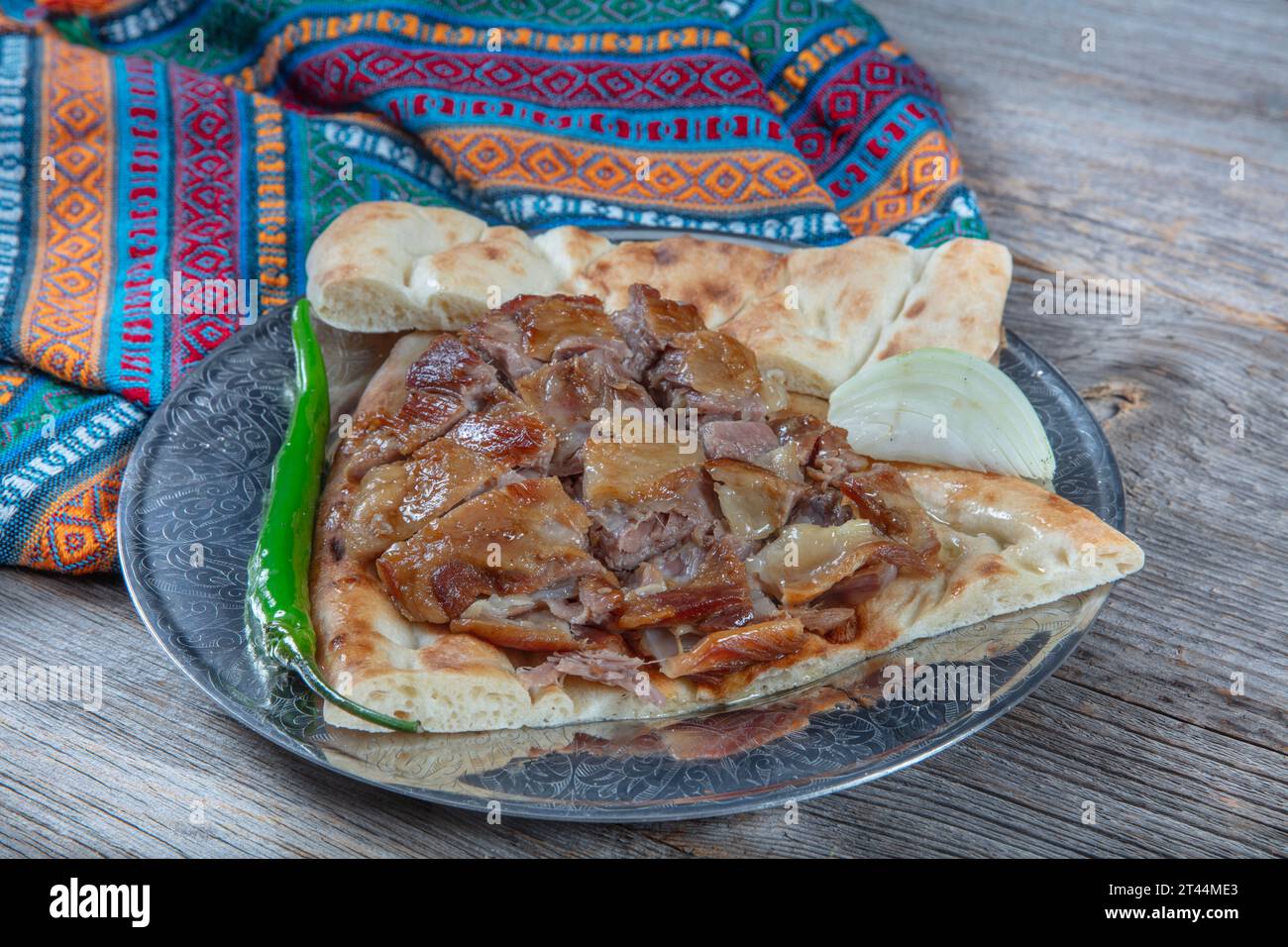 Turkish cuisine lamb ribs on pita bread. Tandoori style lamb chops and ...