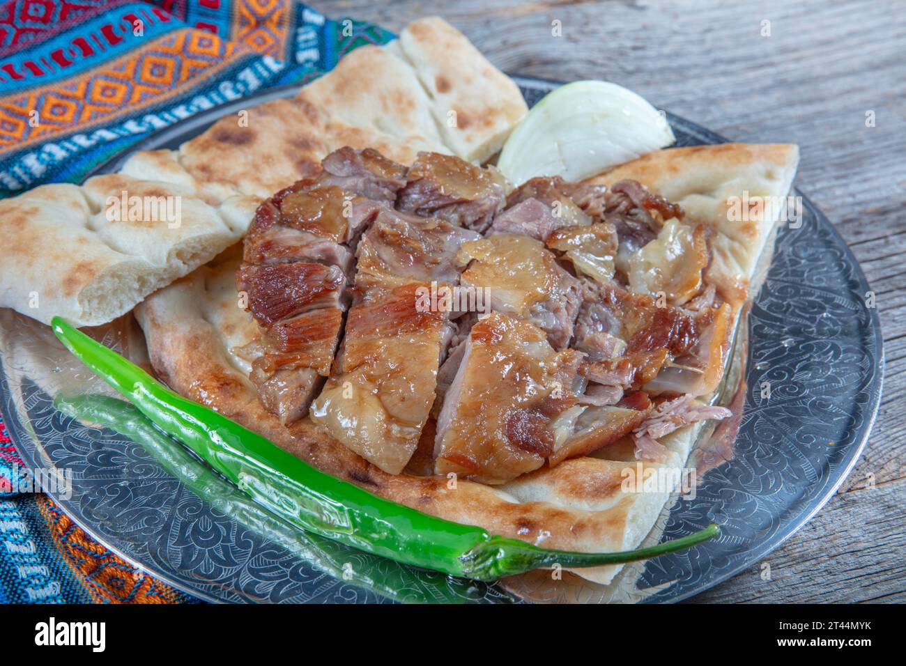 Turkish cuisine lamb ribs on pita bread. Tandoori style lamb chops and ...