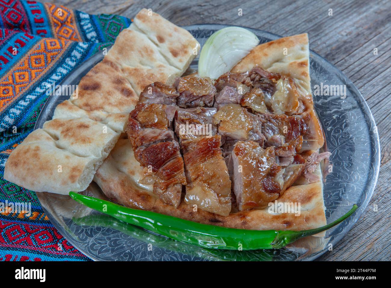 Turkish cuisine lamb ribs on pita bread. Tandoori style lamb chops and ...