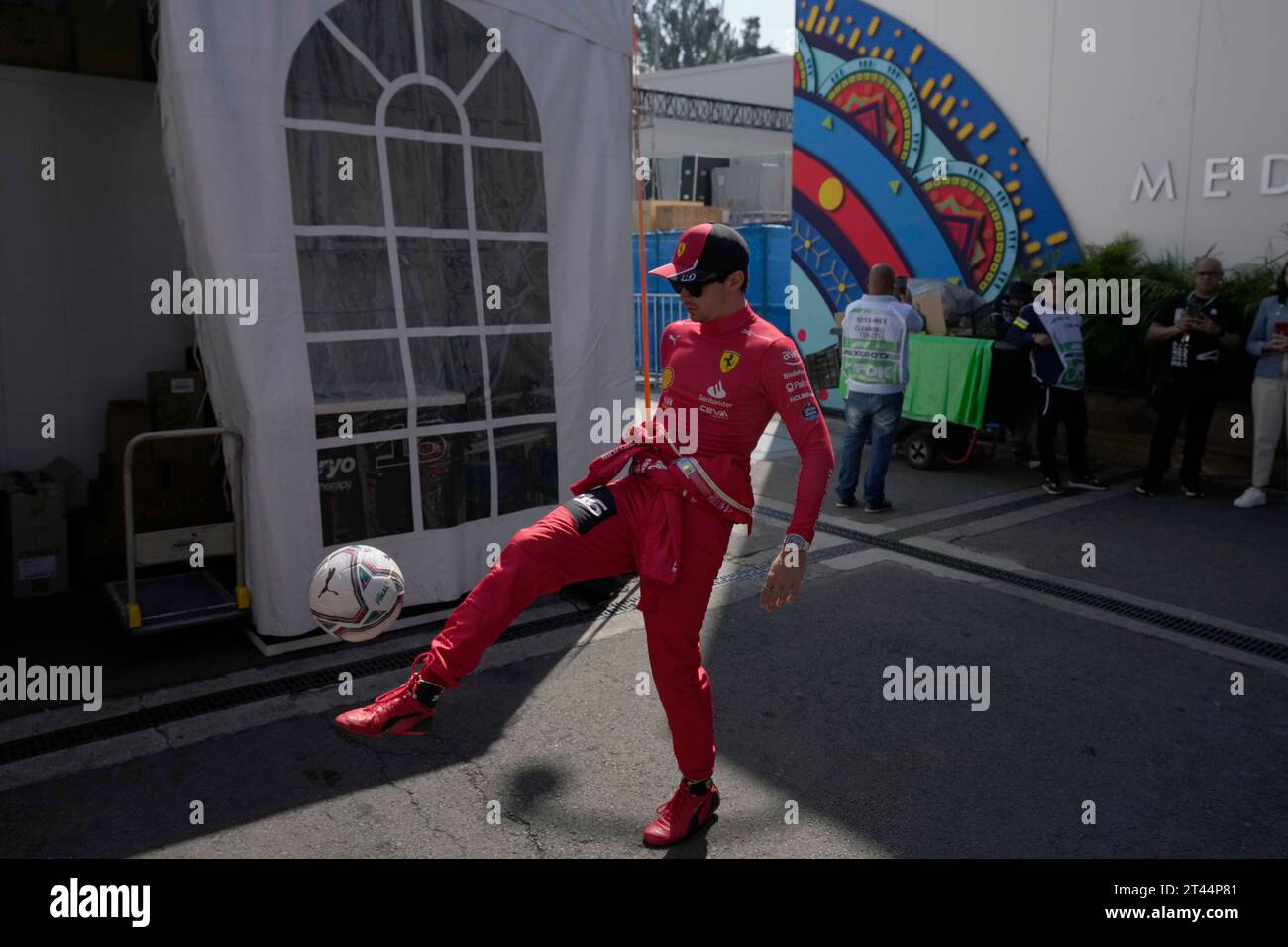 Charles Leclerc, of Monaco, plays with a football prior to Sunday ...