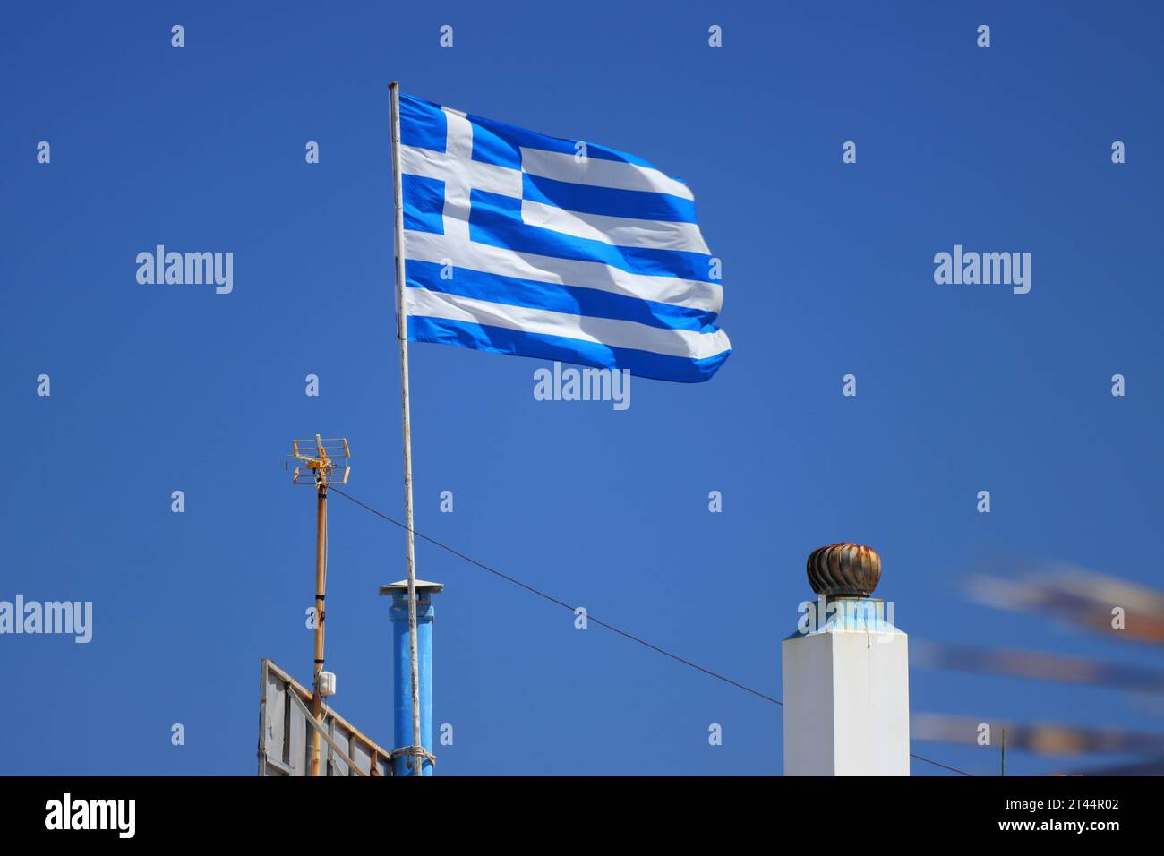 Greek flag on a roof top in sissi, Crete, Greece, Europe Stock Photo ...