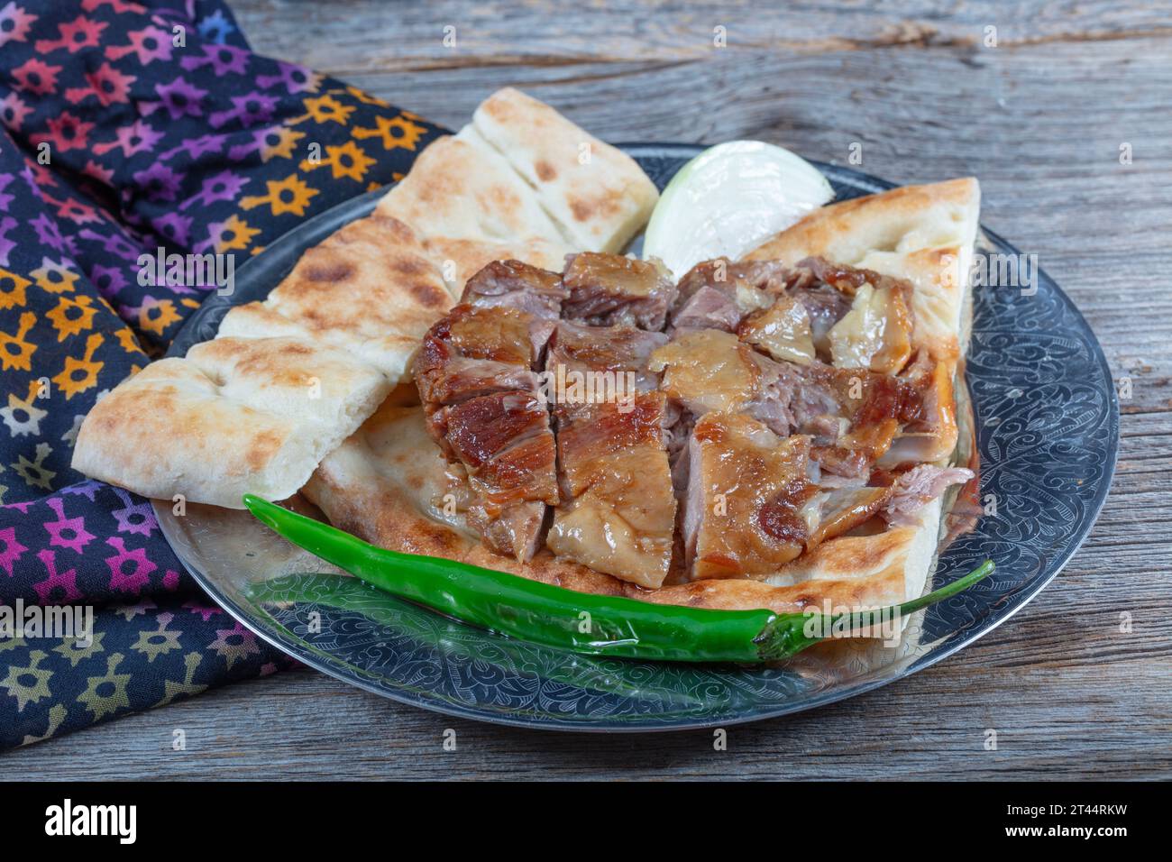 Turkish cuisine lamb ribs on pita bread. Tandoori style lamb chops and ...
