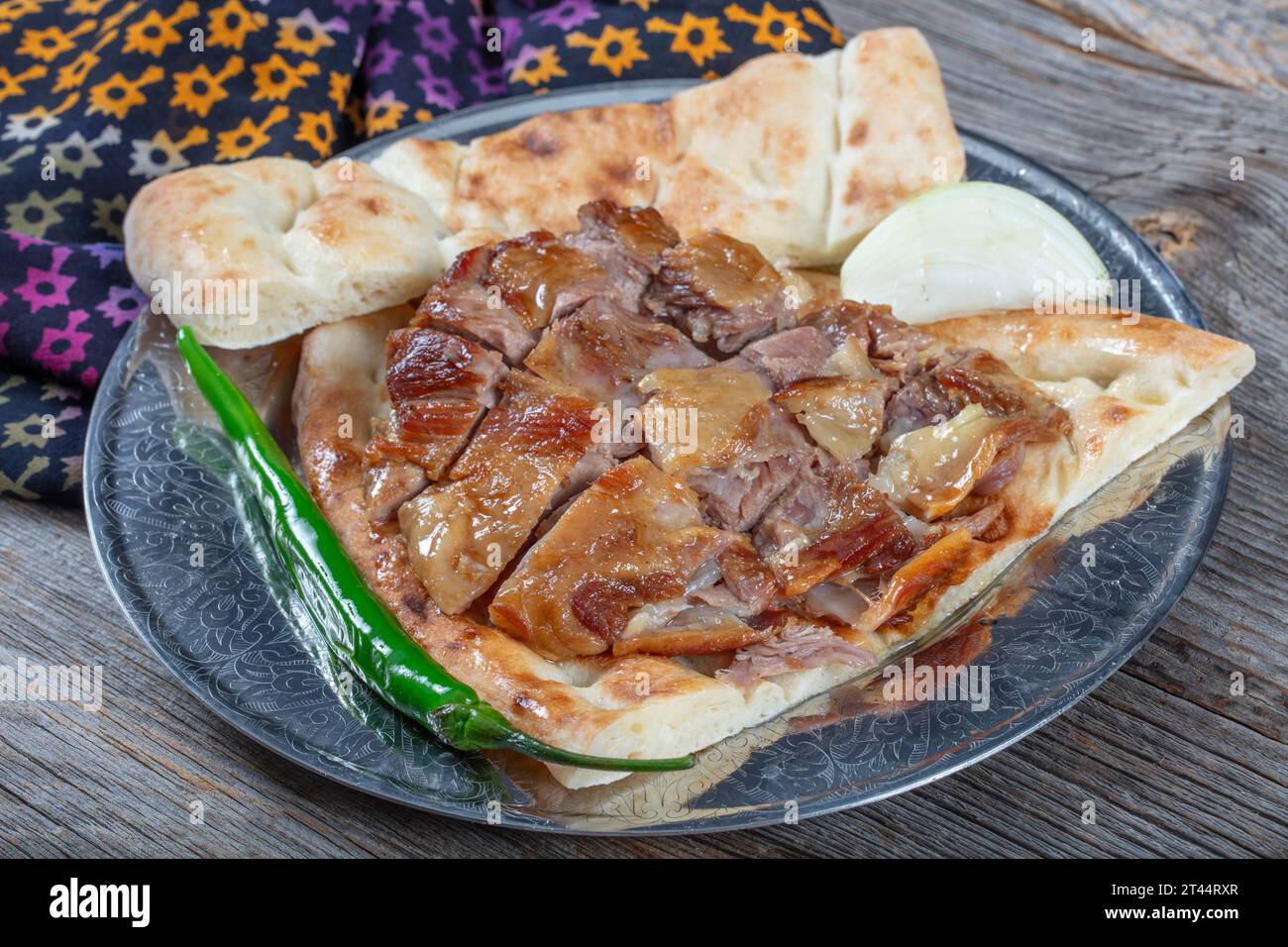 Turkish cuisine lamb ribs on pita bread. Tandoori style lamb chops and ...