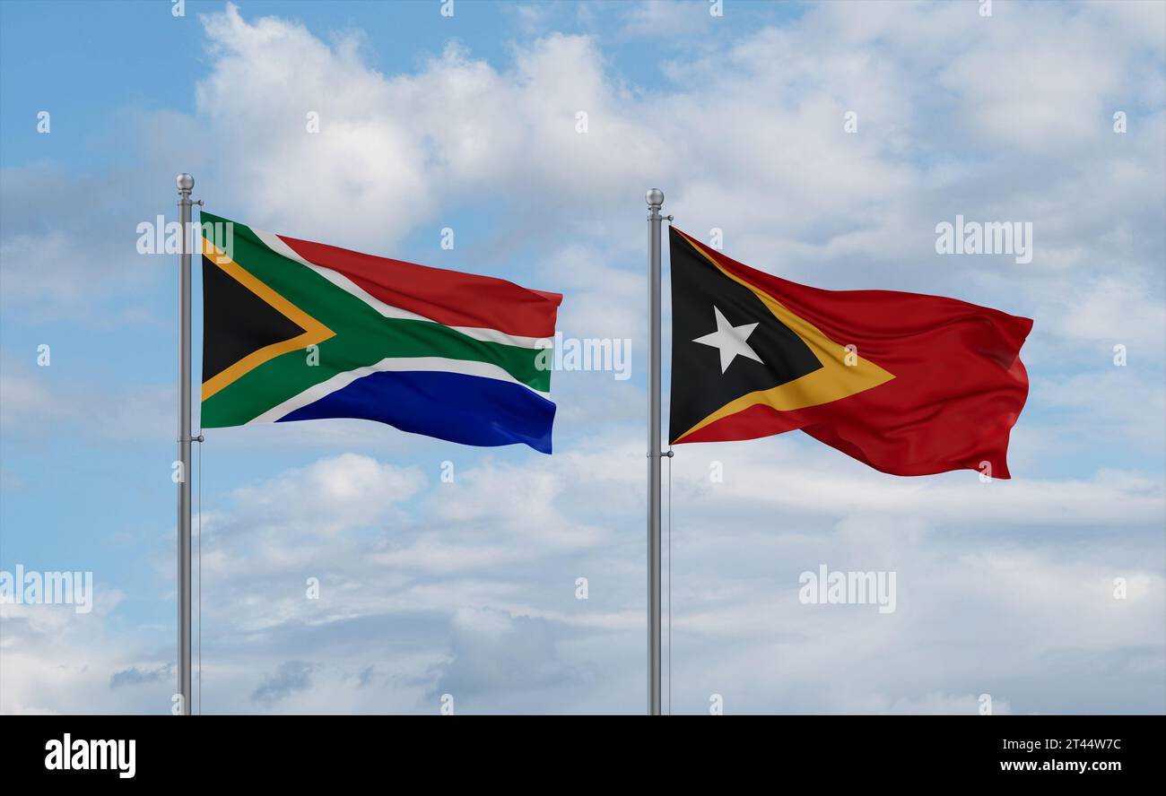 East Timor and South Africa flags waving together in the wind on blue ...