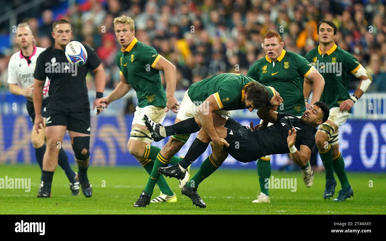 South Africa's Eben Etzebeth (left) tackles New Zealand's Richie Mo ...