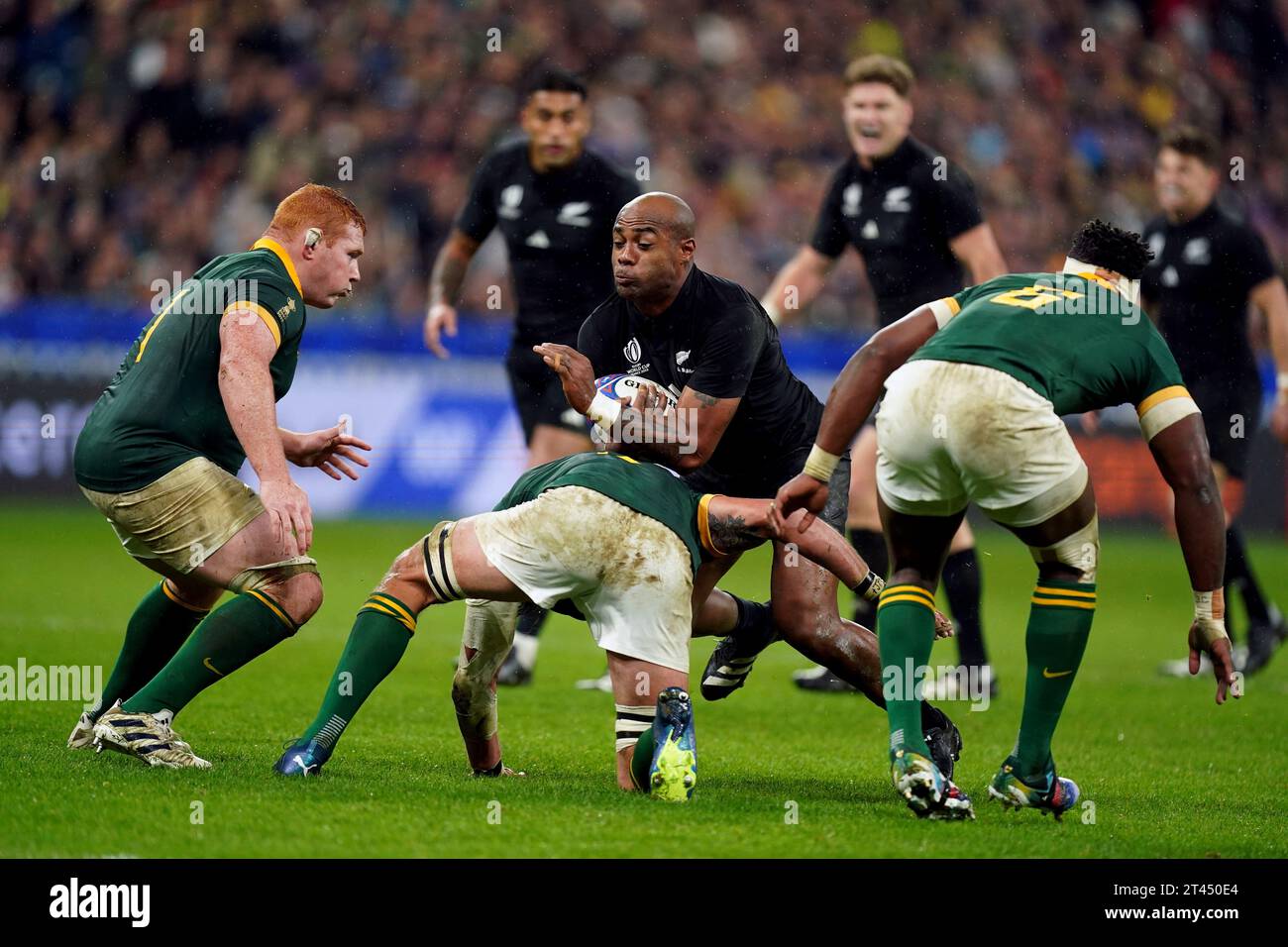 New Zealand's Mark Tele'a is tackled by South Africa's Steven Kitsho ...