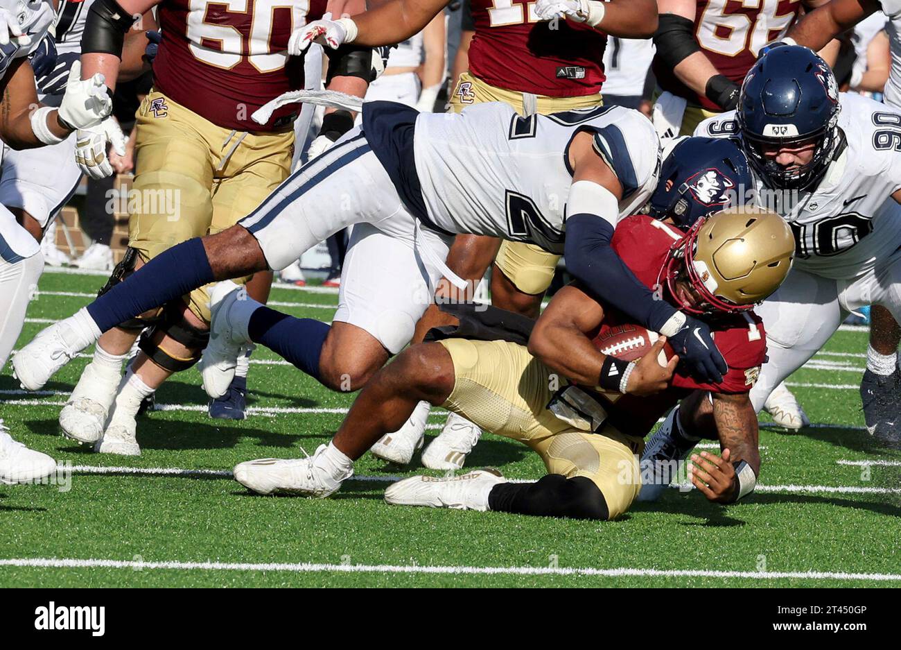 Boston College quarterback Thomas Castellanos (1) is tackled by UConn ...