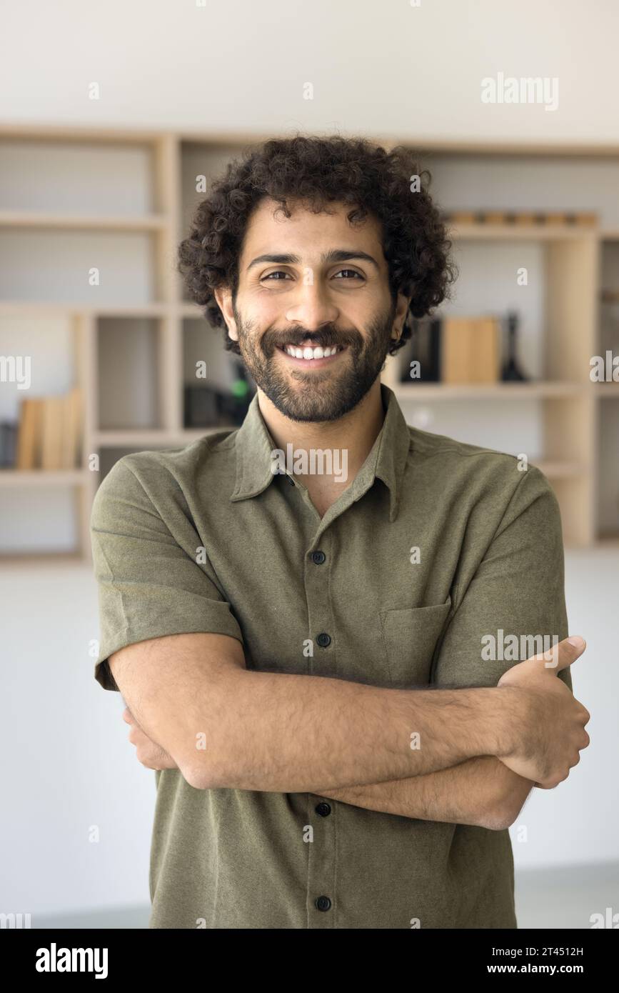 Cheerful handsome young Arab entrepreneur guy posing indoors Stock ...
