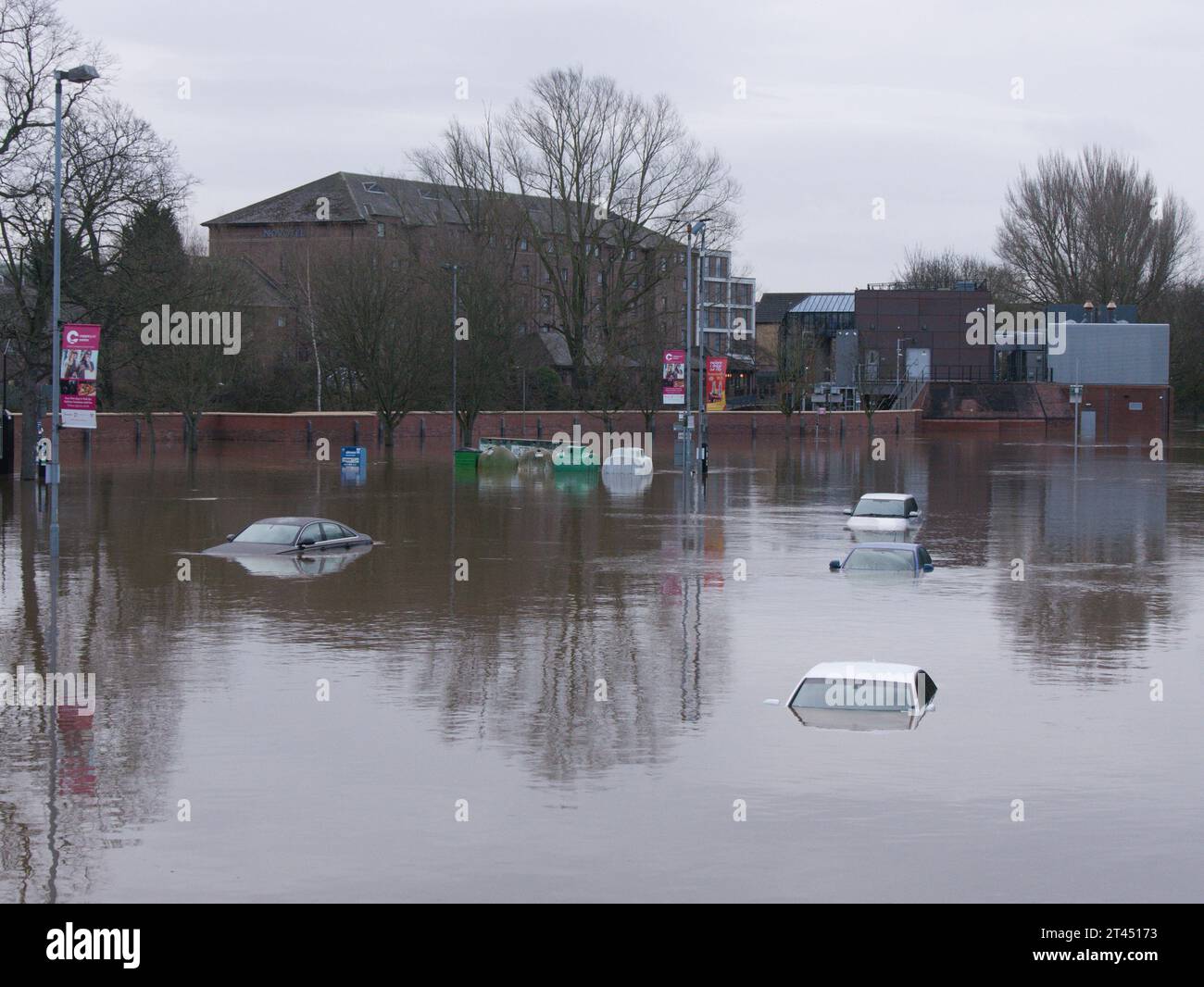 Partially submerged cars in flood water in St George's Field car park ...