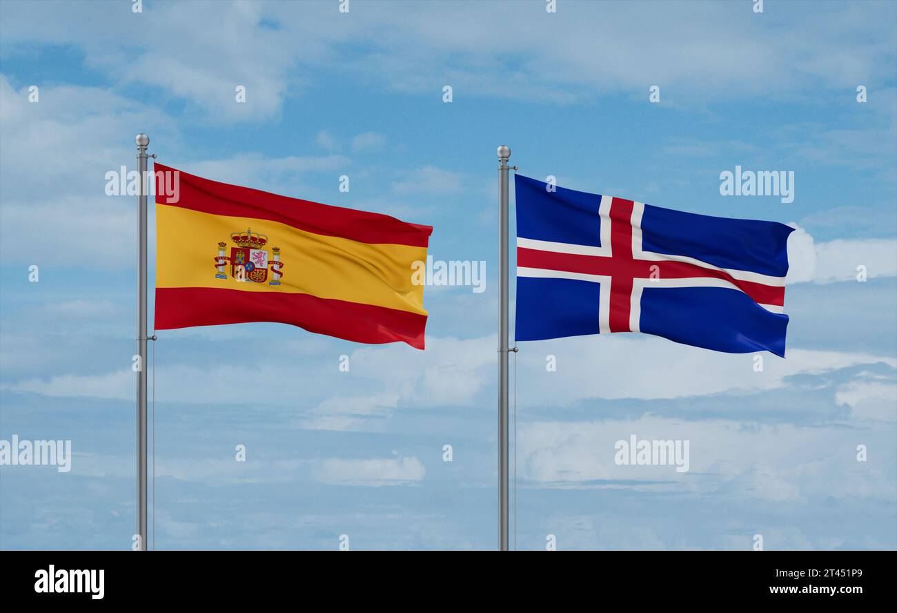 Iceland and Spain flags waving together in the wind on blue cloudy sky ...