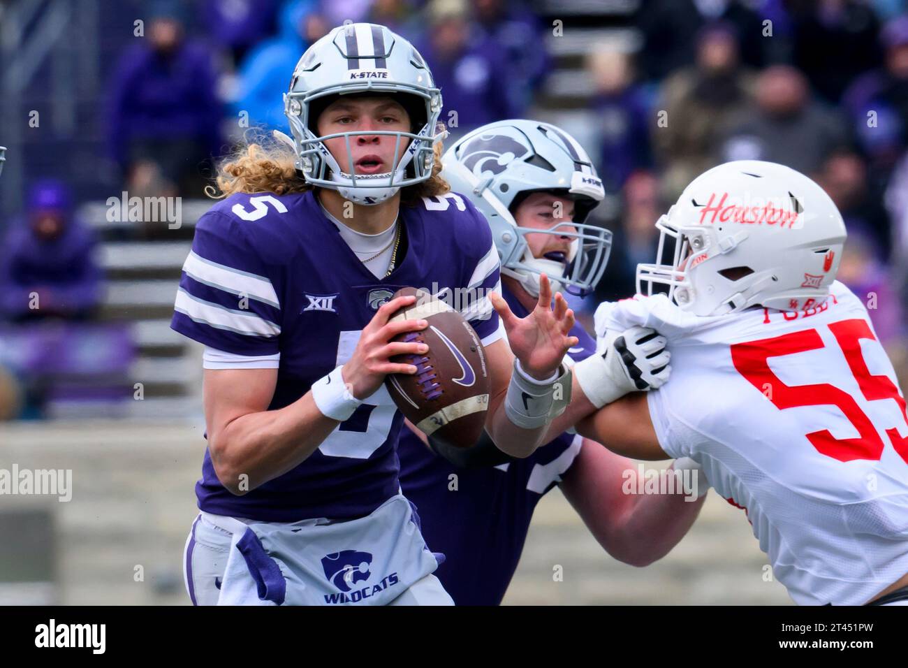 Kansas State quarterback Avery Johnson scrambles away from Houston ...