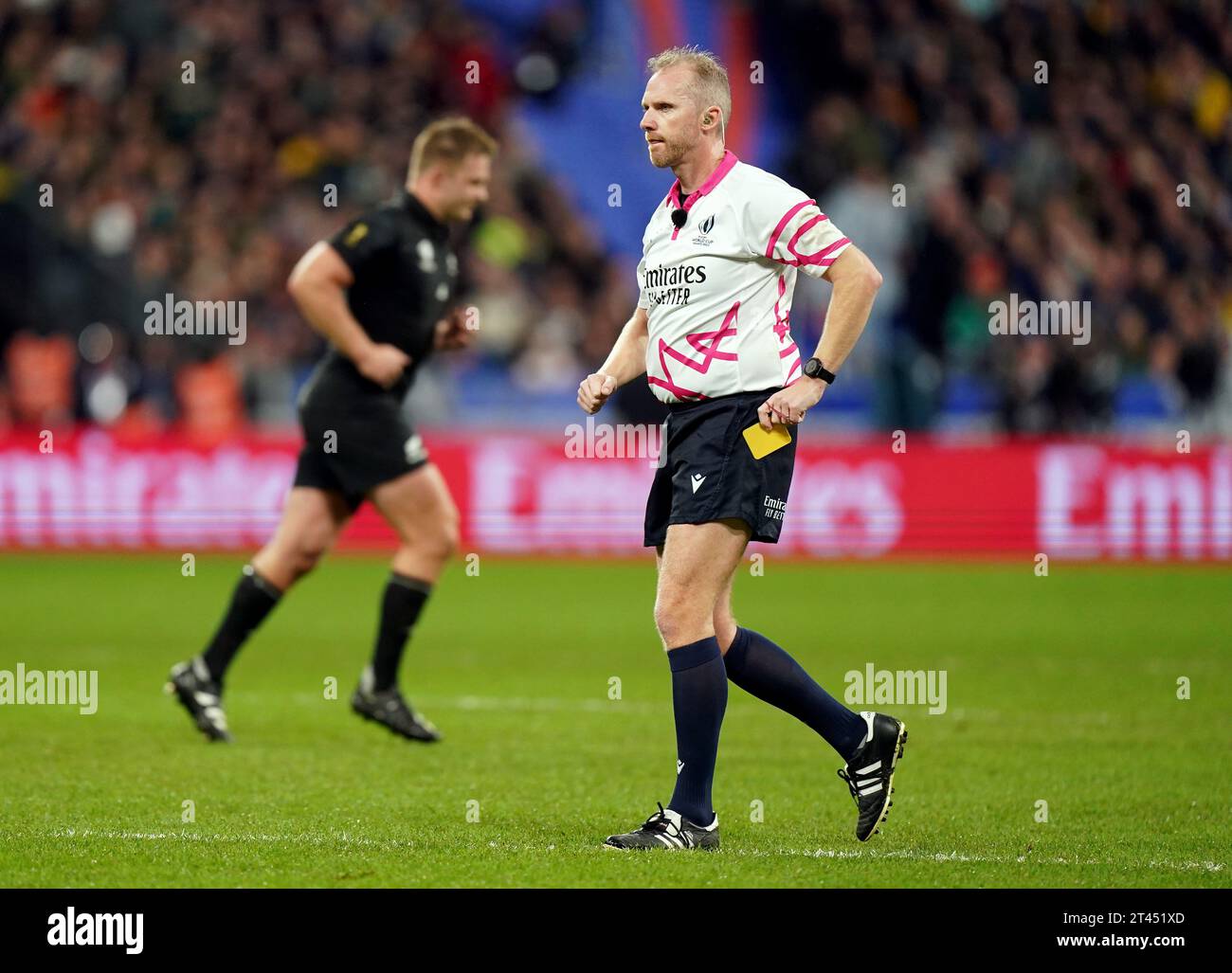 Referee Wayne Barnes shows a yellow card, sending New Zealand's Sam ...