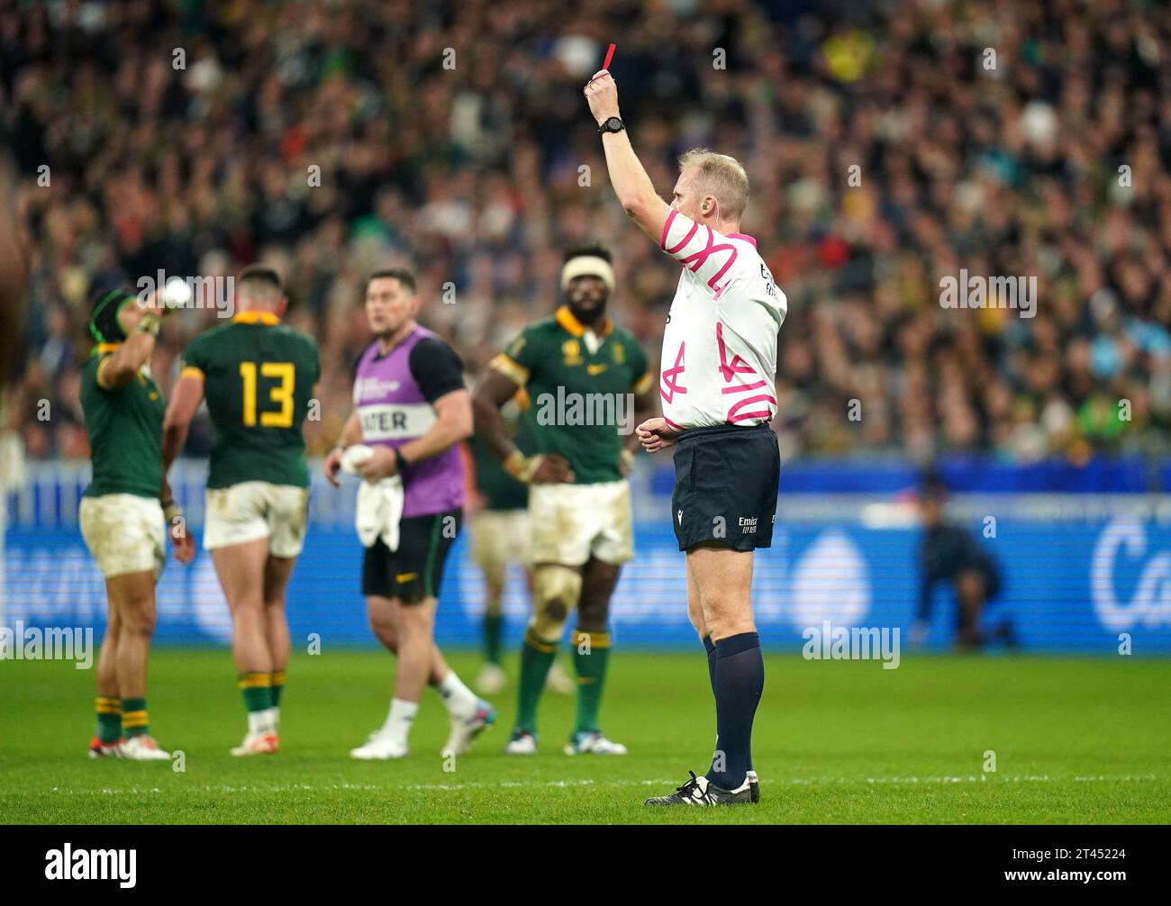 Referee Wayne Barnes shows a red card to New Zealand's Sam Cane (not ...