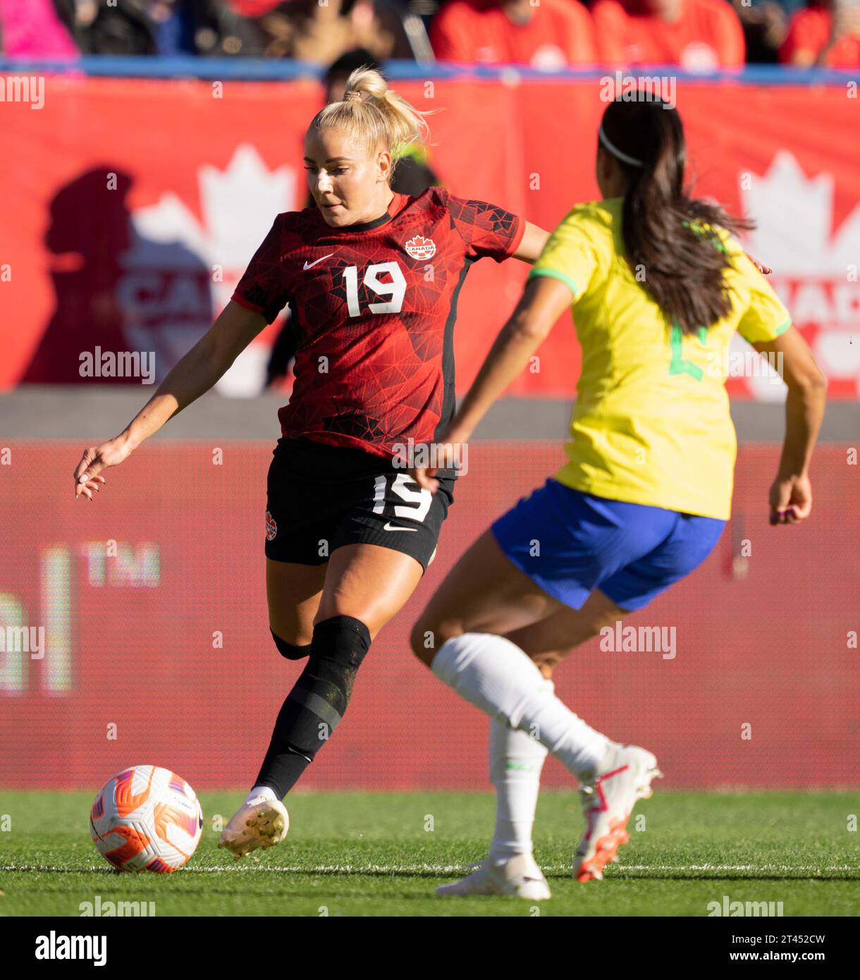 Canada forward Adriana Leon (19) plays the ball as Brazil defender ...