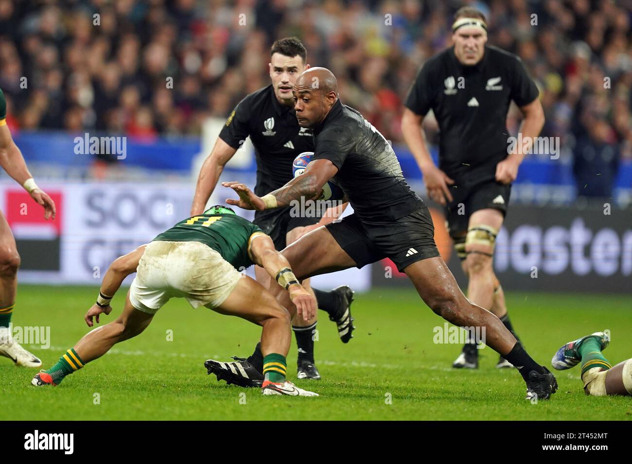 New Zealand's Mark Tele'a is tackled by South Africa's Cheslin Kolbe ...