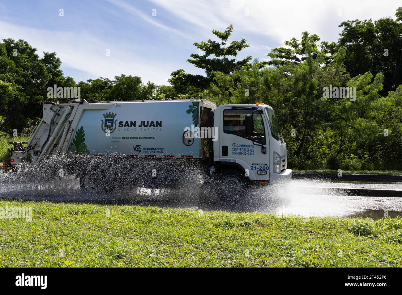Puerto Rico. 28th Oct, 2023. A City of San Juan dump truck rushes ...