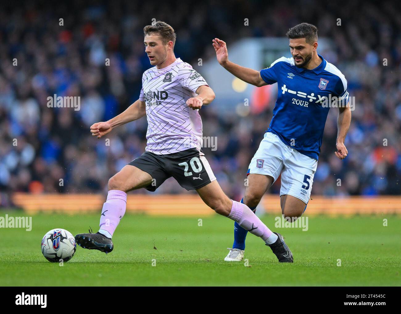 Adam Randell #20 of Plymouth Argyle on the ball while under pressure ...