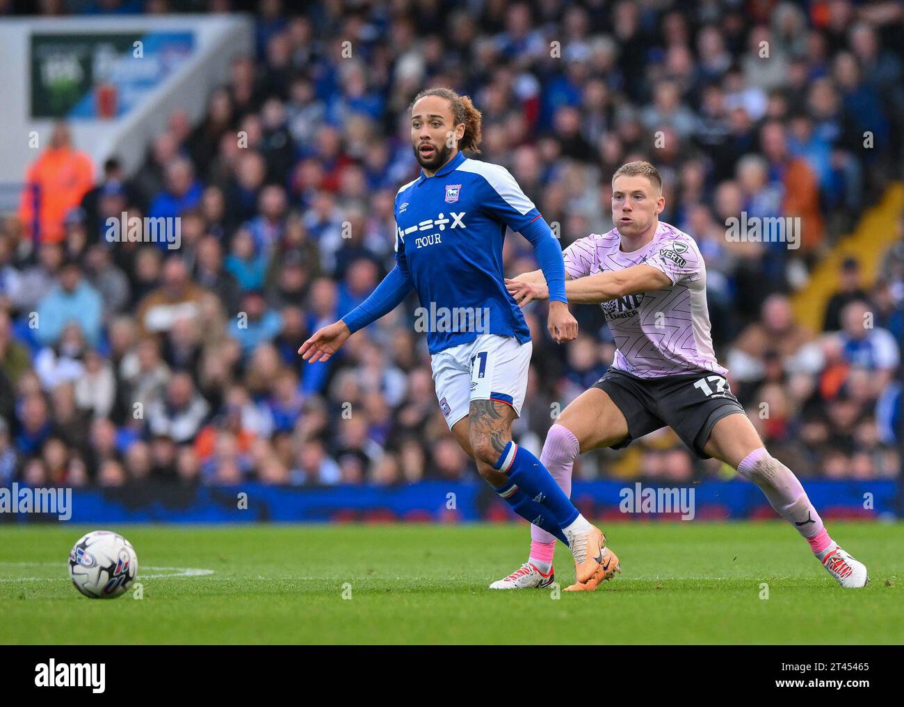 Lewis Gibson #17 of Plymouth Argyle defending Marcus Harness #11 of ...