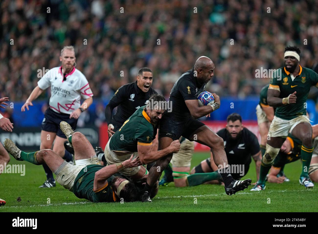 New Zealand's Mark Telea is tackled by South Africa's Eben Etzebeth ...