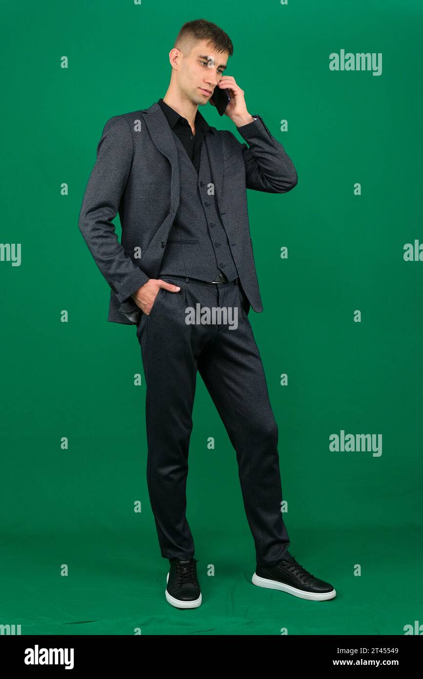 emotions of handsome man guy on a green background chromakey close-up ...