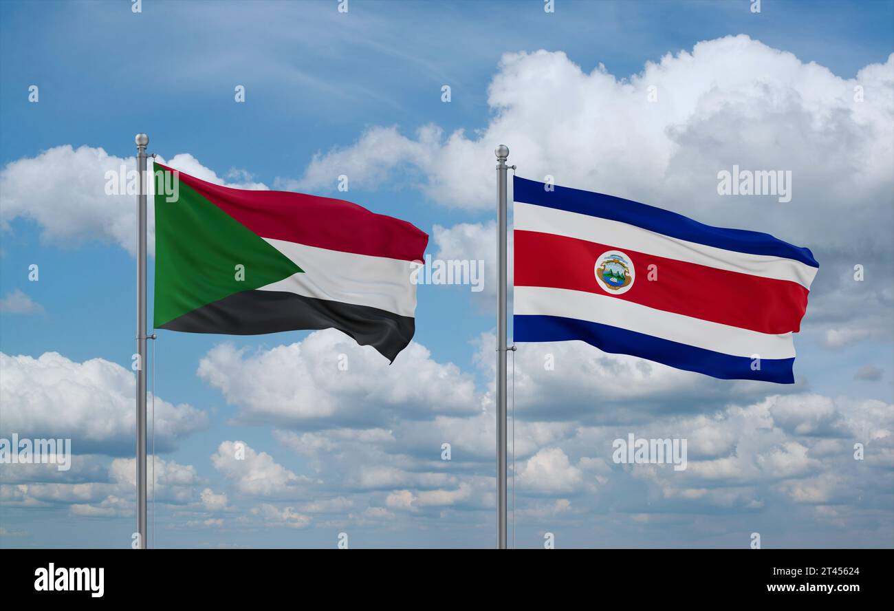 Costa Rico and Sudan flags waving together in the wind on blue cloudy ...