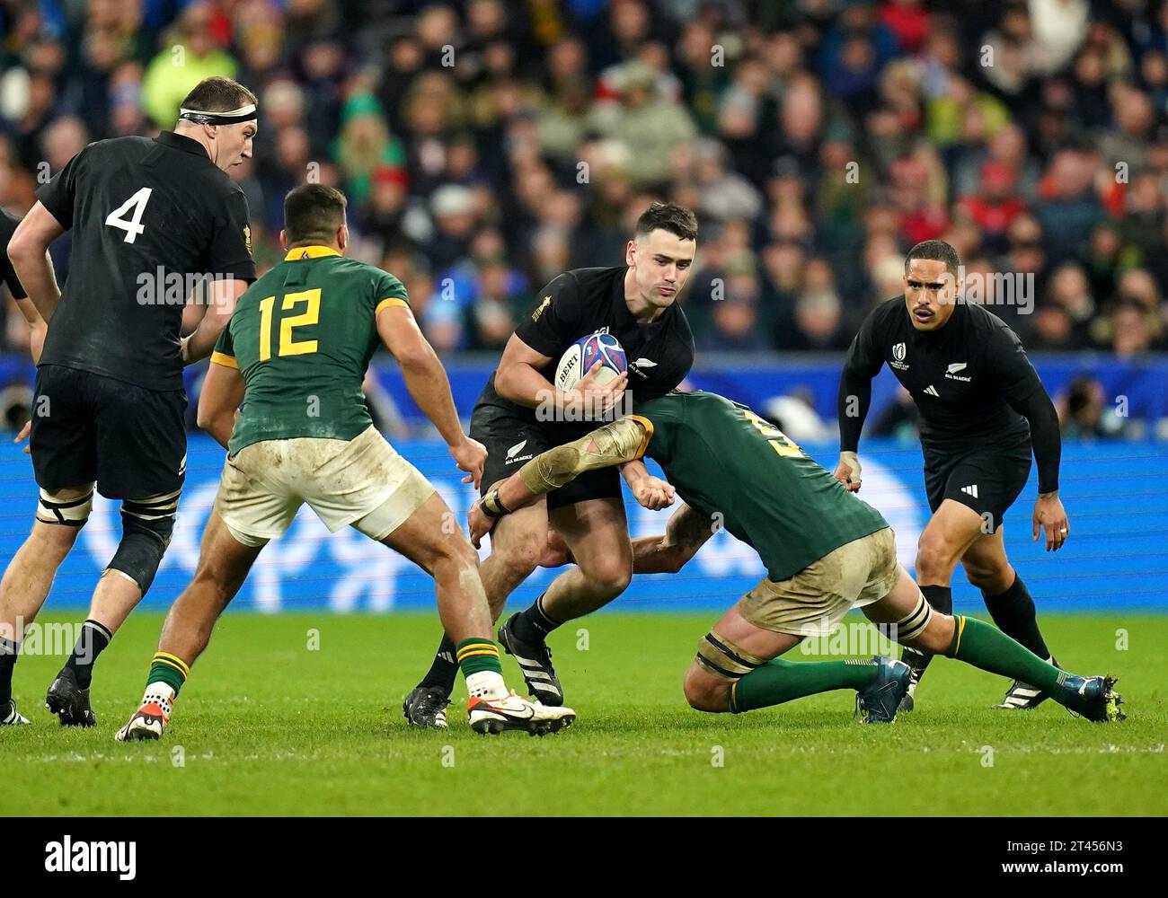 New Zealand's Will Jordan is tackled by South Africa's Franco Mostert ...