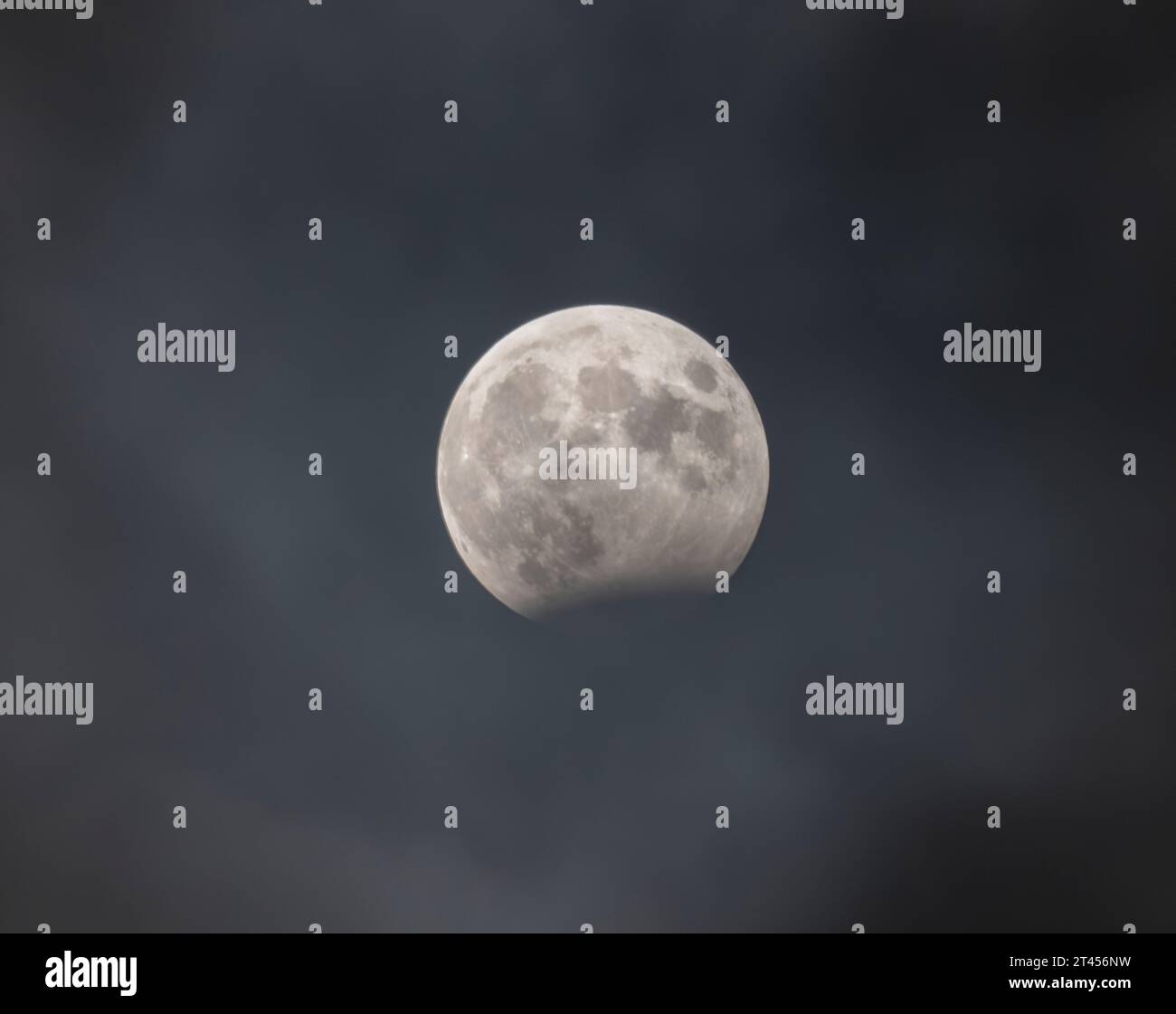 London, UK. 28th Oct, 2023. Partial lunar eclipse at its almost full ...