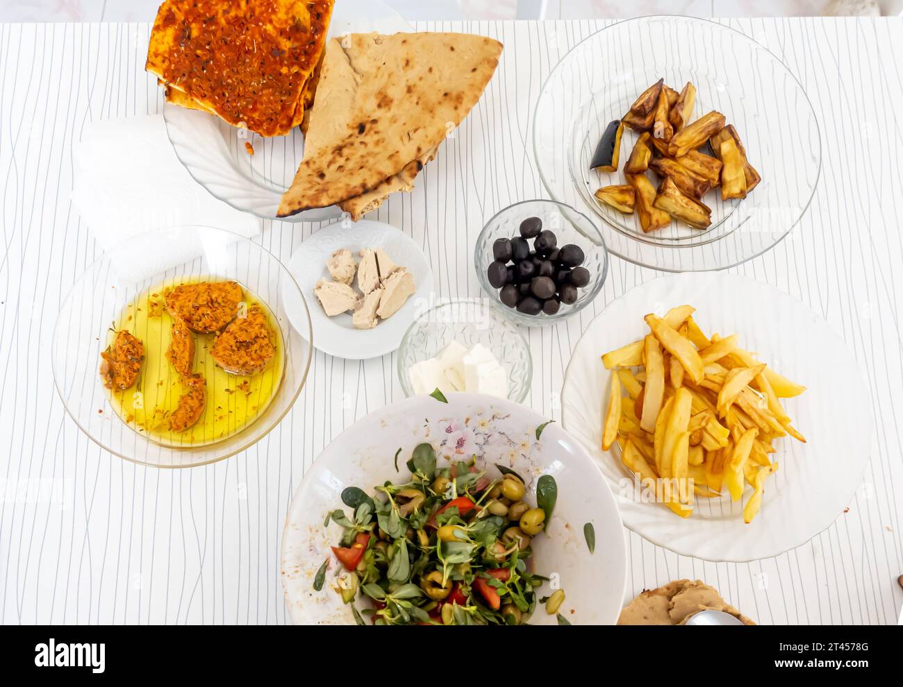 Turkish breakfast served in Hatay province: olives, bread, salad Stock ...