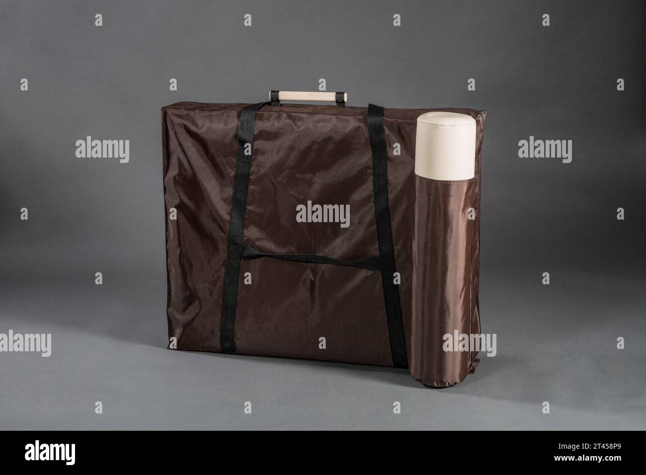 Bag With Portable Folding Massage Table For Physical Therapy Treatment Room On The Dark