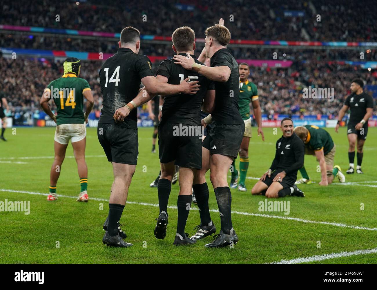 New Zealand's Beauden Barrett (centre) celebrates after scoring their ...
