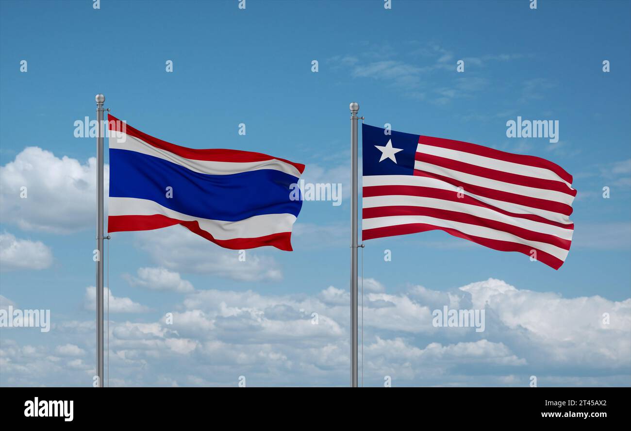 Liberia and Thailand flags waving together in the wind on blue cloudy ...