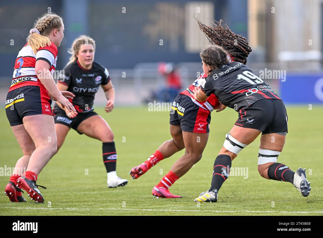 Sophie Tansley of Saracens Women tackles Jordan Russell of Gloucester-Hartpury Women during the ...