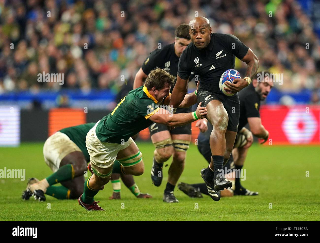 New Zealand's Mark Tele'a is tackled by South Africa's Kwagga Smith ...