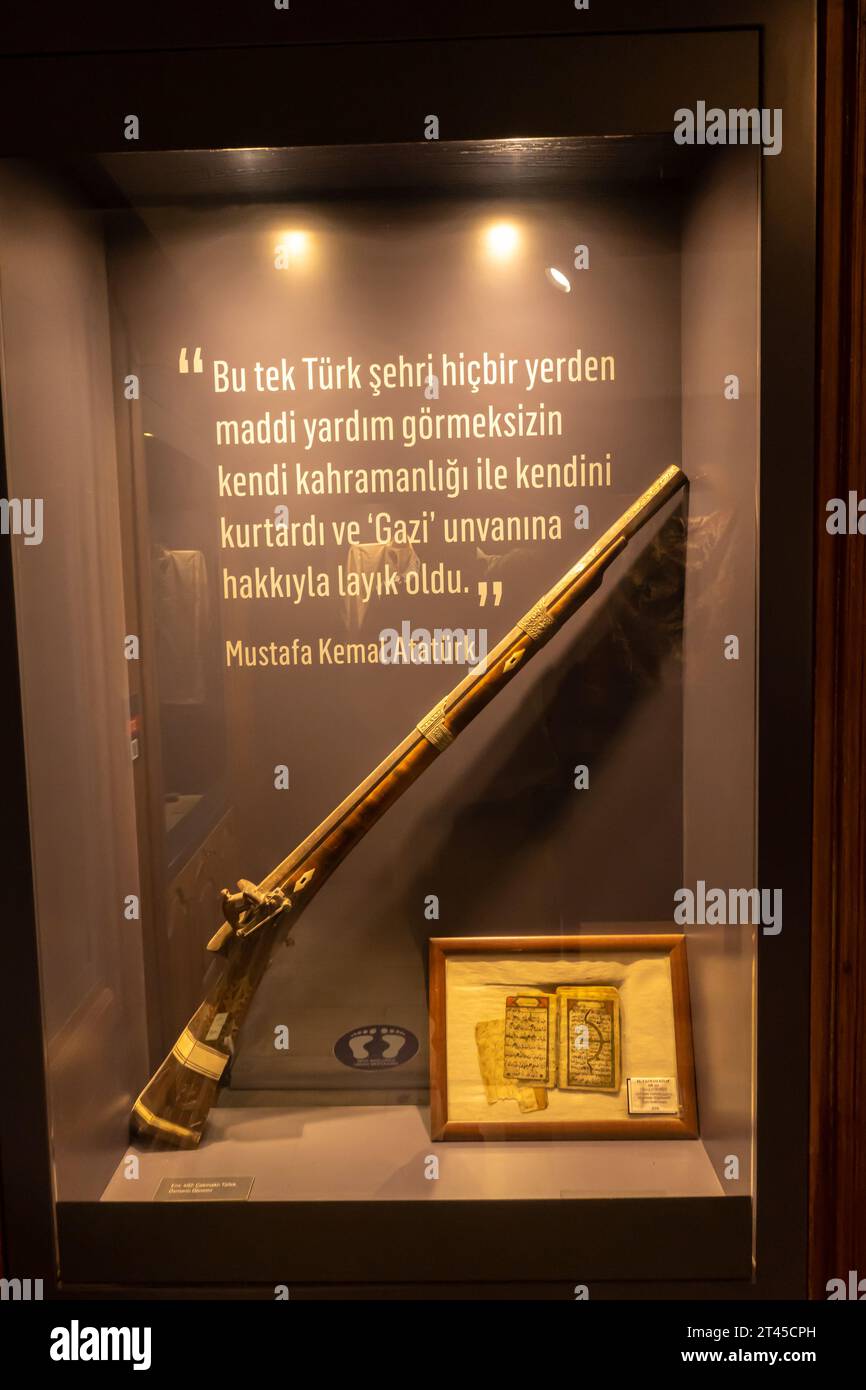 Installation with a gun and a quote from Mustafa Kemal Ataturk praising ...